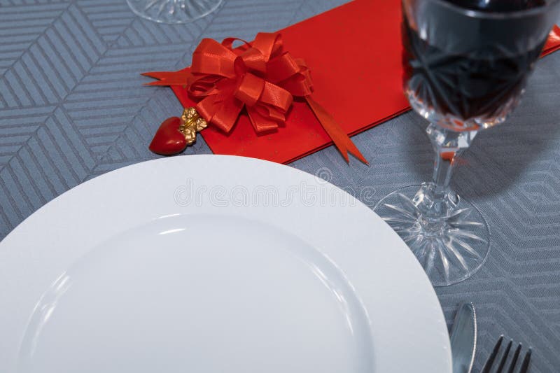 Two Glasses with Red Wine and Gift with a Heart and an Angel on the ...