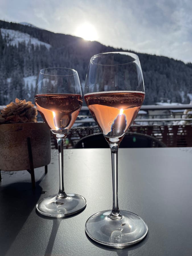 Two Glasses of Rose Prosecco on a Table with a View of the Setting Sun ...