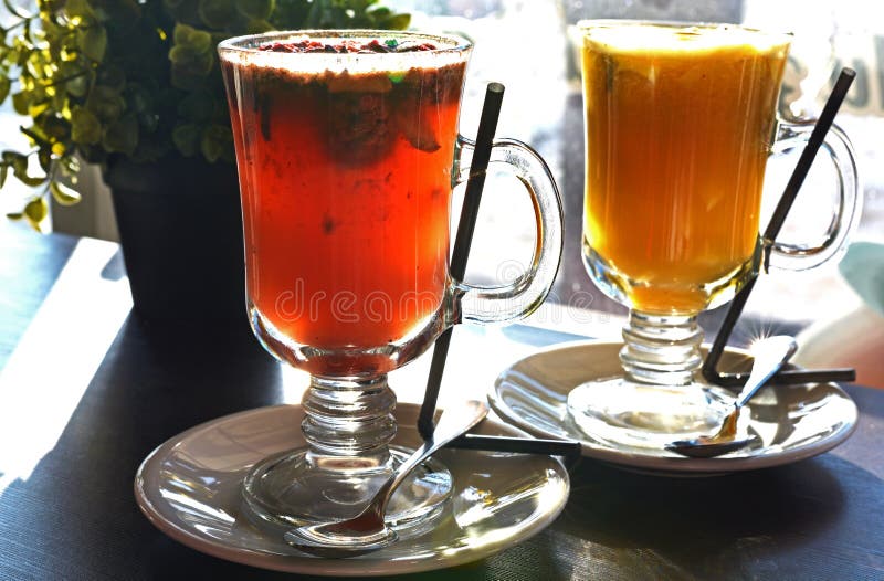 Two Glasses of Rum Punch with Raspberry and Spices Stock Photo - Image ...
