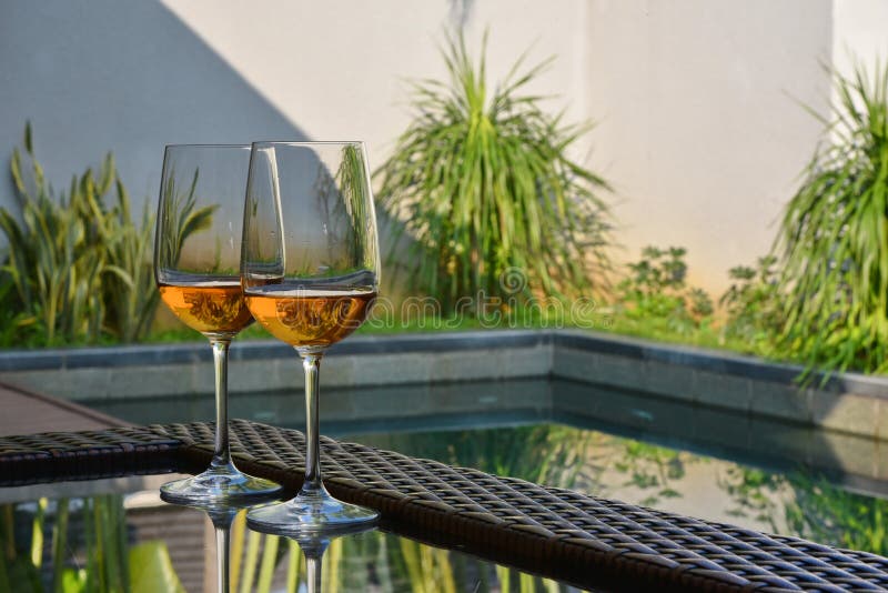 The Wine Glasses on the Table by the Pool Stock Photo - Image of ...
