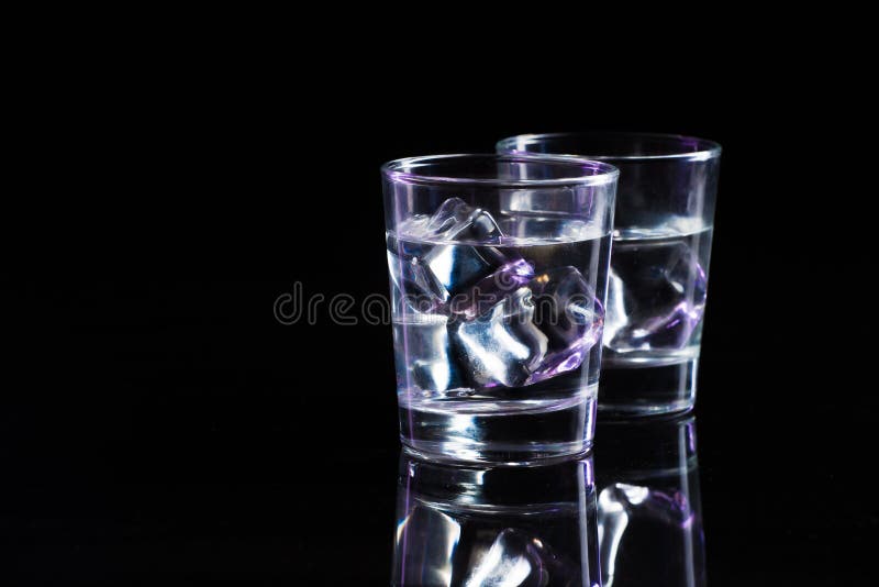 Two Glasses of Vodka with Ice Cubes Stock Photo - Image of cocktail ...