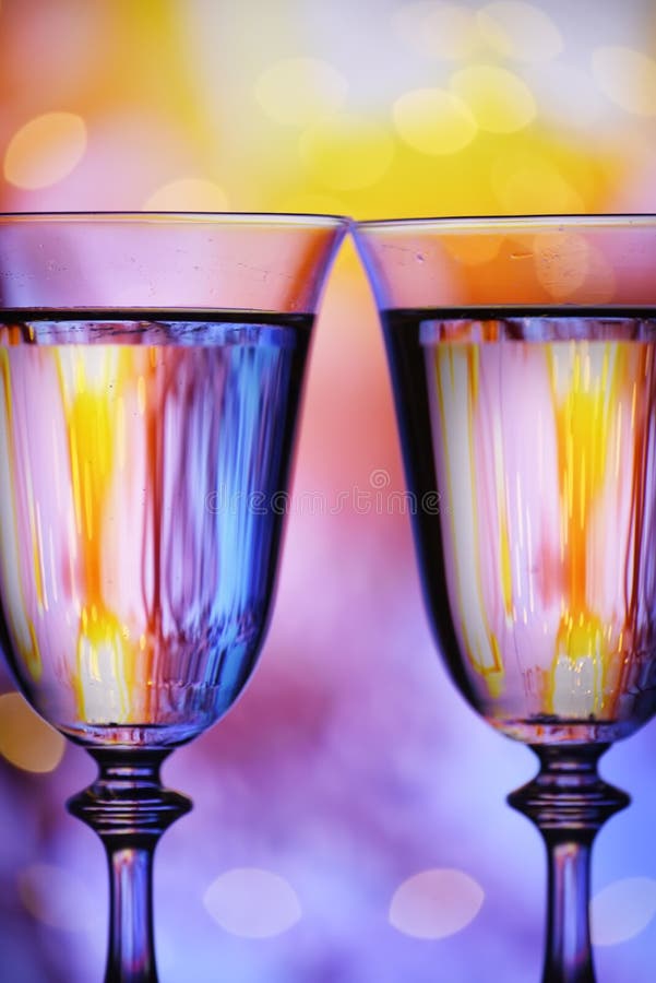 Two Glasses of Wine on the Background of Multi-colored Lights . Stock ...
