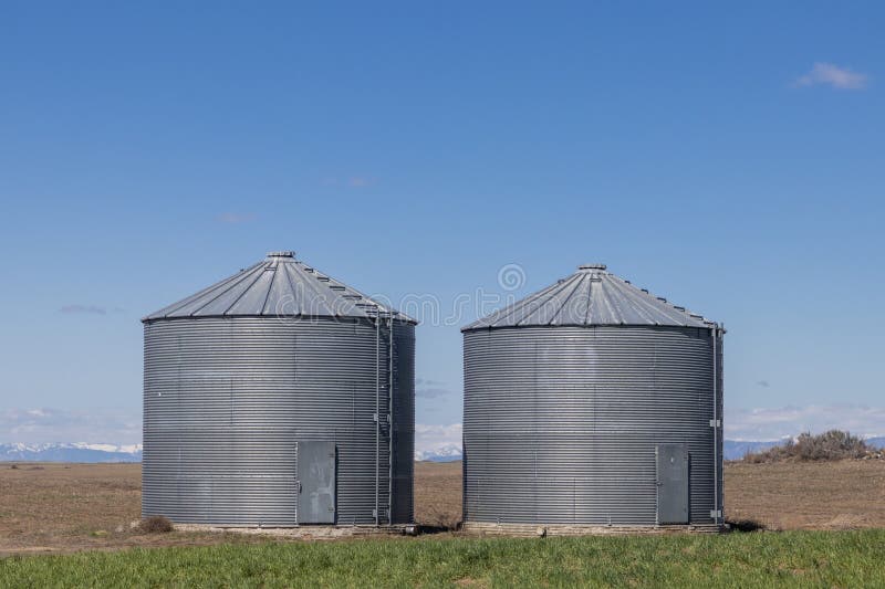 Two glavanized grain silos stock photo. Image of scene - 319811052