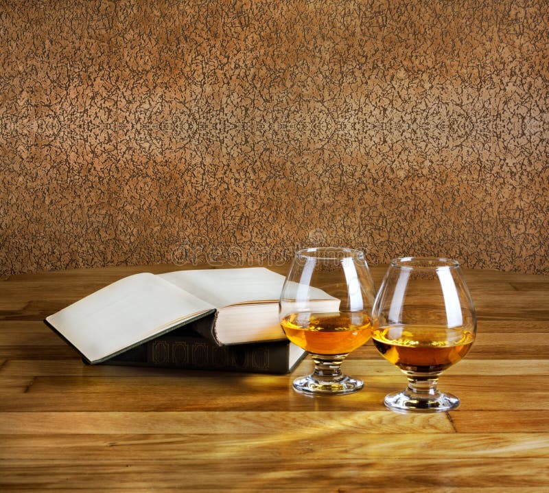 Two Goblets of Brandy and Open Book Stock Photo - Image of goblet ...