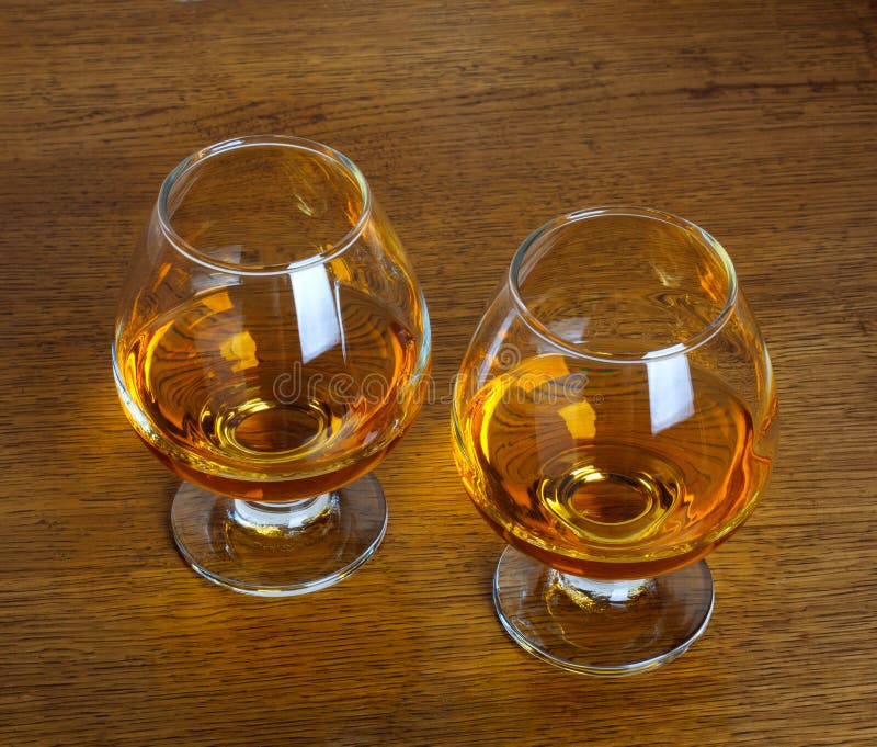 Two Goblets of Brandy on Wooden Counter Top Stock Image - Image of ...
