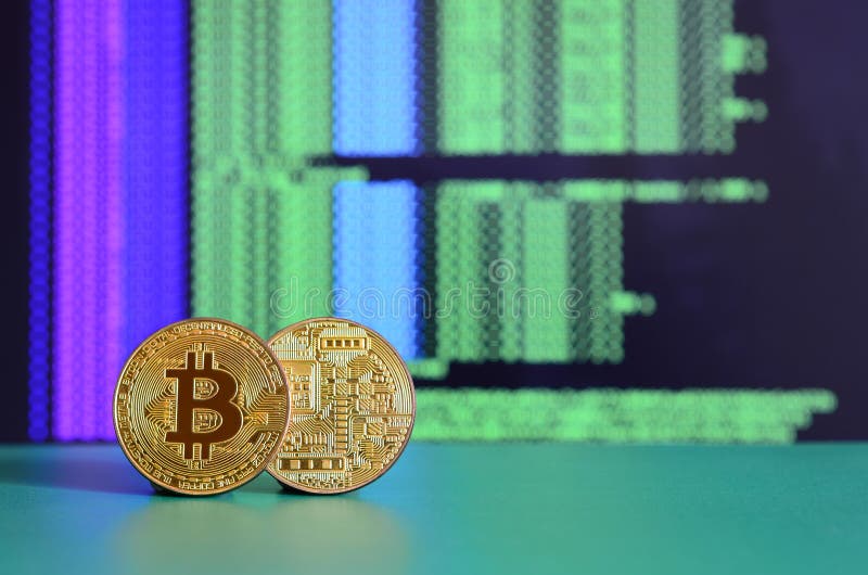 Two Gold Bitcoins Lie on the Green Surface on the Background of Stock ...