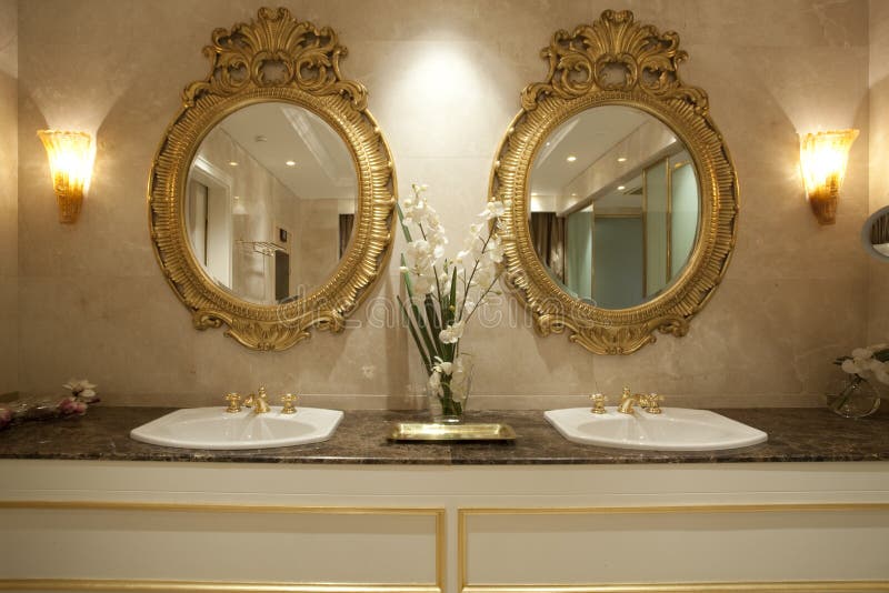 Two gold mirrors stock photo. Image of property, glass - 13833802