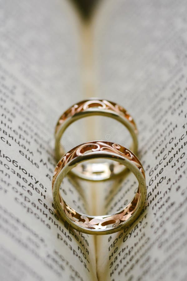 Two Gold Rings Placed in the Book Stock Image - Image of symbol ...