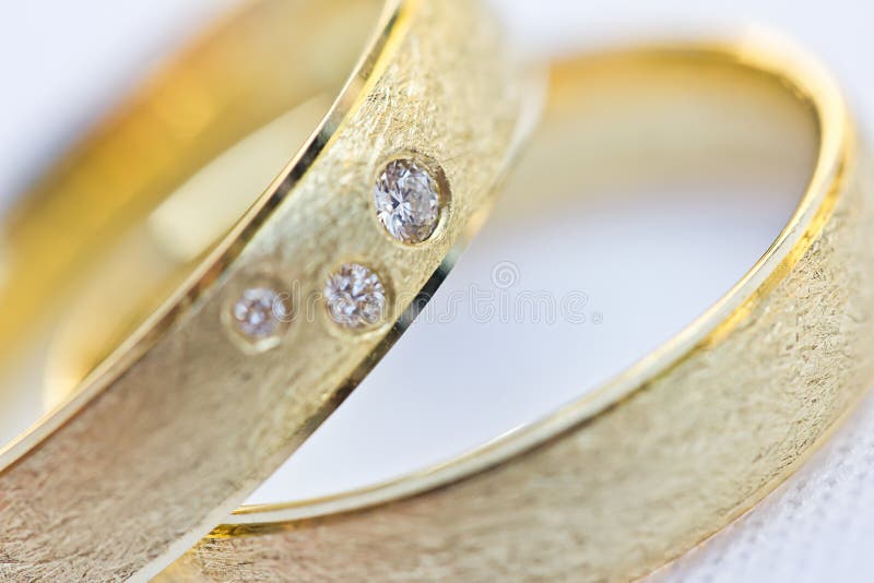 Two Gold Wedding Rings with Diamonds Stock Photo - Image of closeup ...