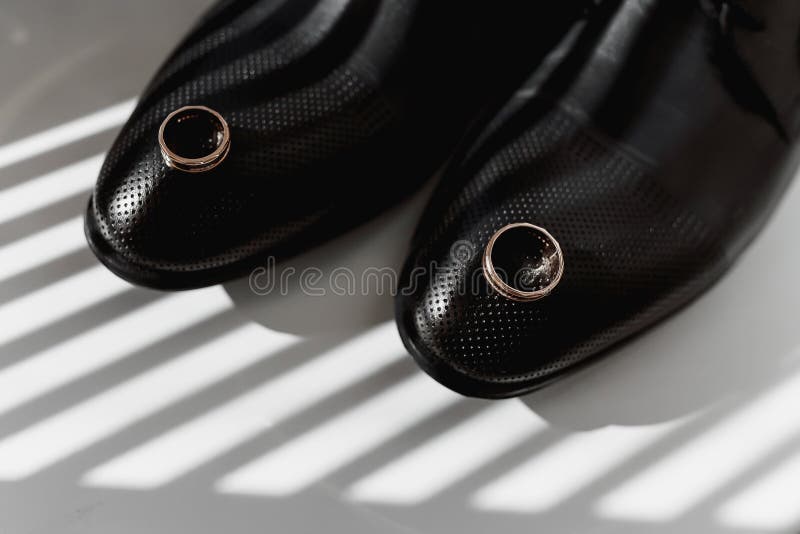 Two Golden Textured Wedding Rings on Rays of Falling Light Stock Photo ...