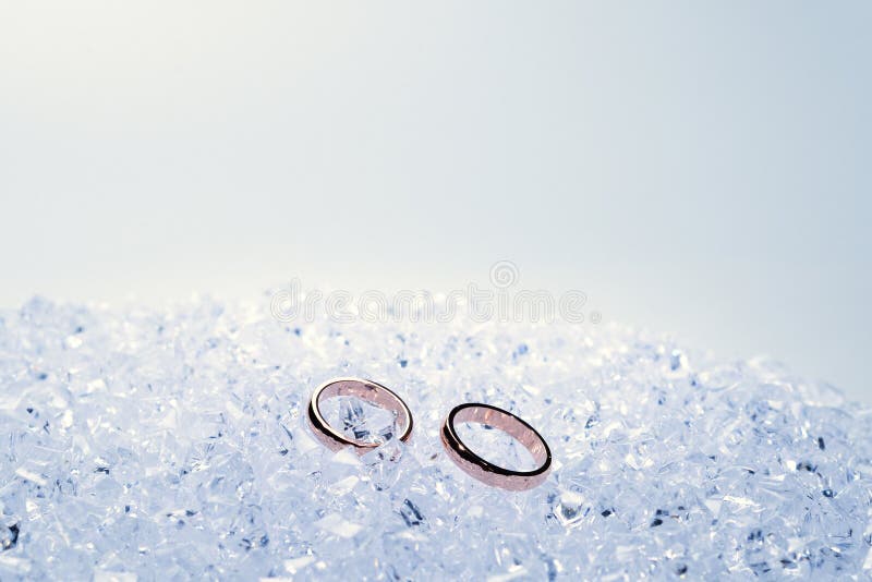 Two Golden Wedding Rings on Ice Stock Image - Image of marriage ...