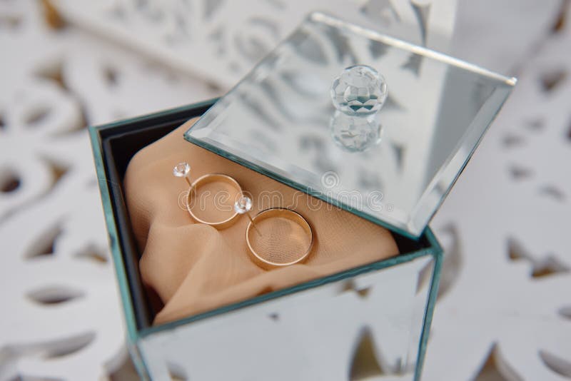 Two Golden Wedding Rings on Mirror Glass Box, Copy Space. Stock Image ...