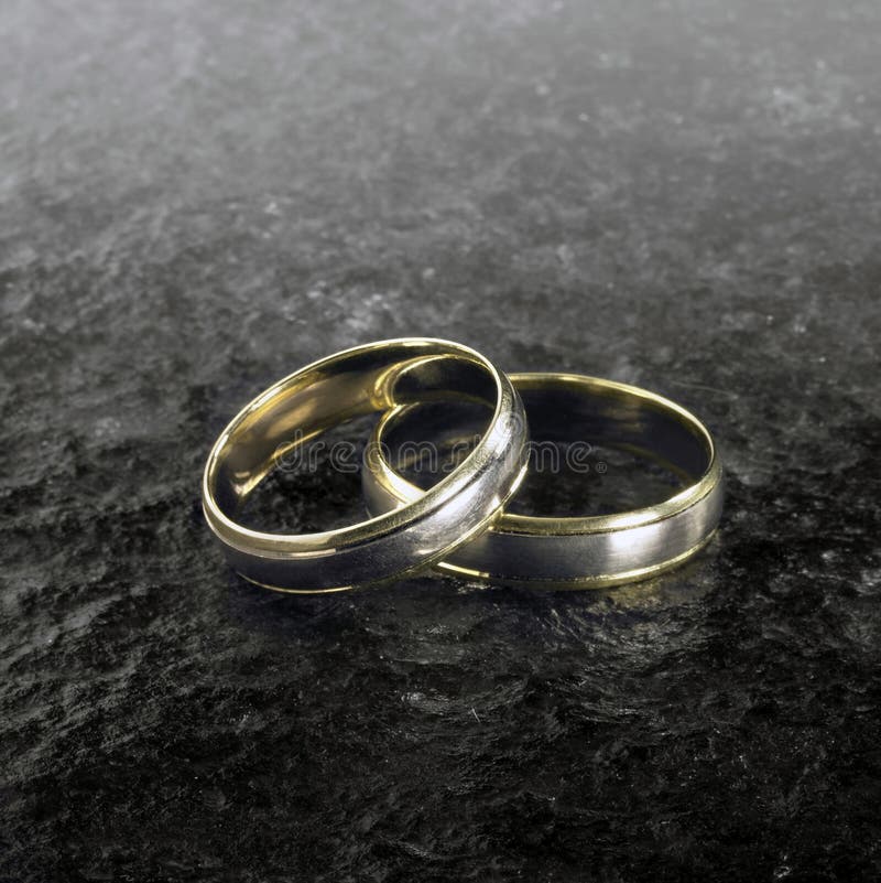 Two Golden Wedding Rings on Stone Surface Stock Photo - Image of stone ...