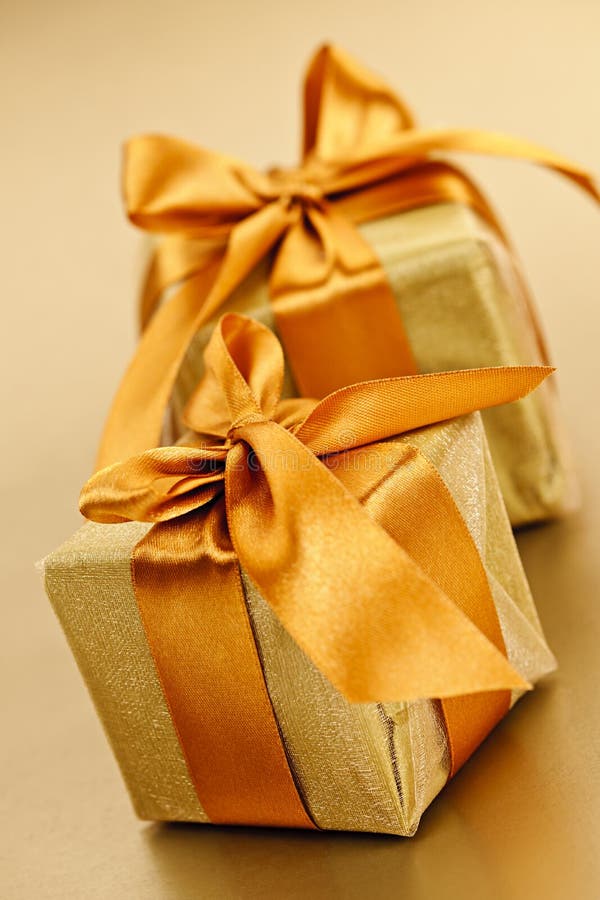 Two Golden Wrapped Gift Boxes Stock Photo - Image of pattern, bows ...