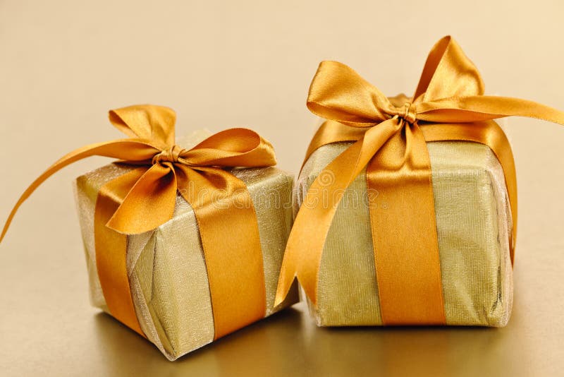 Two Golden Wrapped Gift Boxes Stock Photo - Image of pattern, bows ...