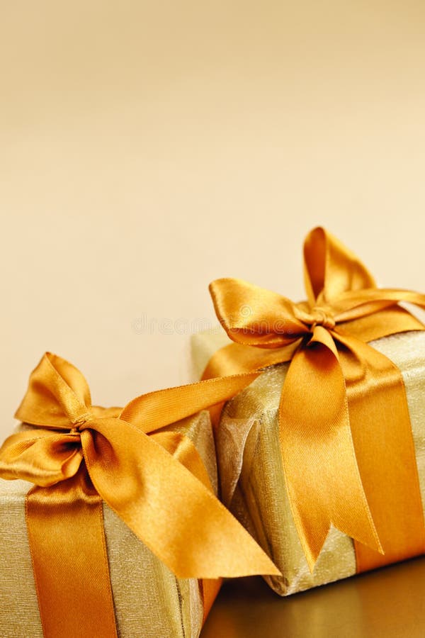 Two Golden Wrapped Gift Boxes Stock Photo - Image of pattern, bows ...