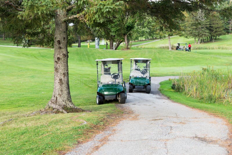 Two Golf Carts on the Golf Course Stock Image - Image of summer, field ...