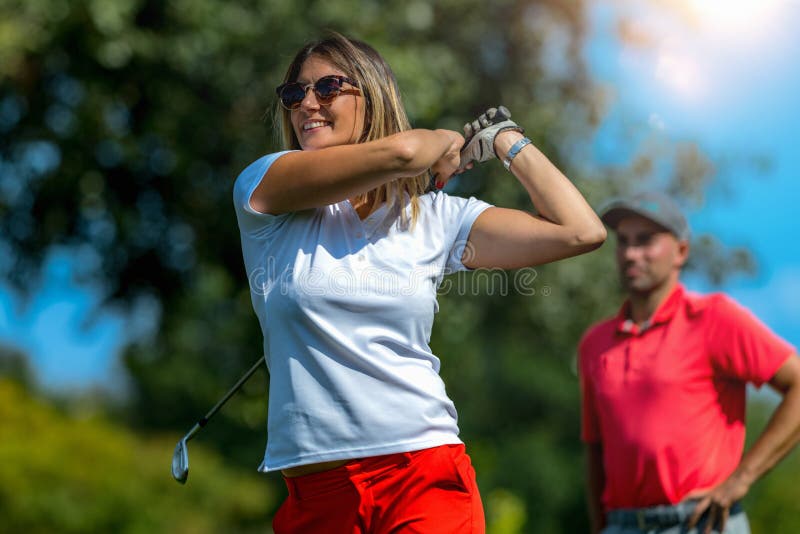 Two Golfers, Female and Male Playing Golf Stock Photo - Image of woman ...