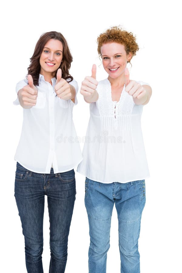 Two Gorgeous Casual Models Posing with Thumbs Up Stock Image - Image of ...