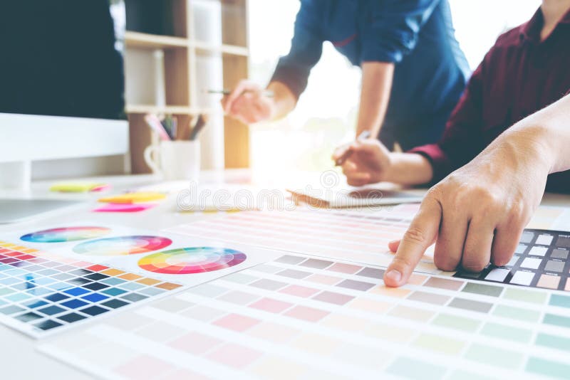 Two Graphic Designer Drawing on Graphics Tablet and Color Palette Guide ...