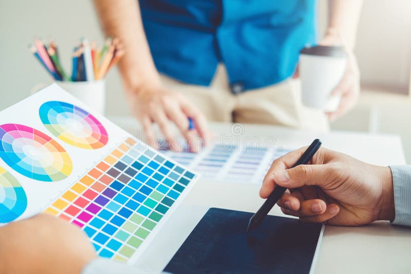 Two Graphic Designer Drawing on Graphics Tablet and Color Palette Guide ...