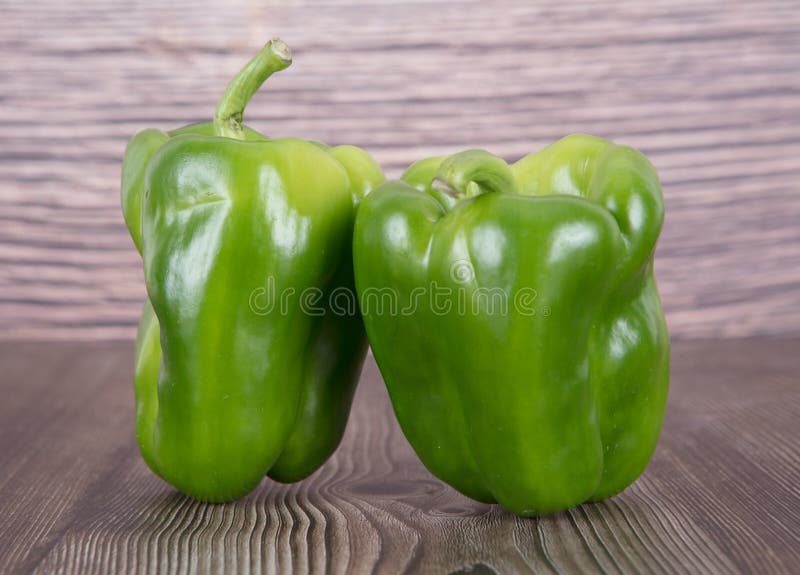 Two Green Bell Peppers on Table Stock Photo - Image of shiny, vegetable ...