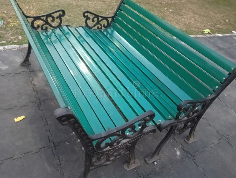 Two Green Chair on Black Leather Tiles in the Park Stock Photo - Image ...