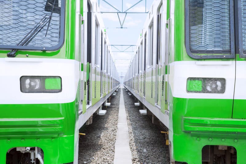 Two green electric trains stock photo. Image of transportation - 79261124