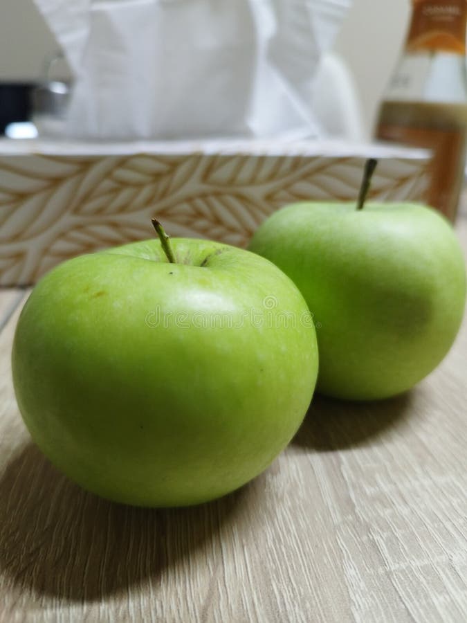 Two Green and Fresh Crispy Apples on a Table Stock Image - Image of ...