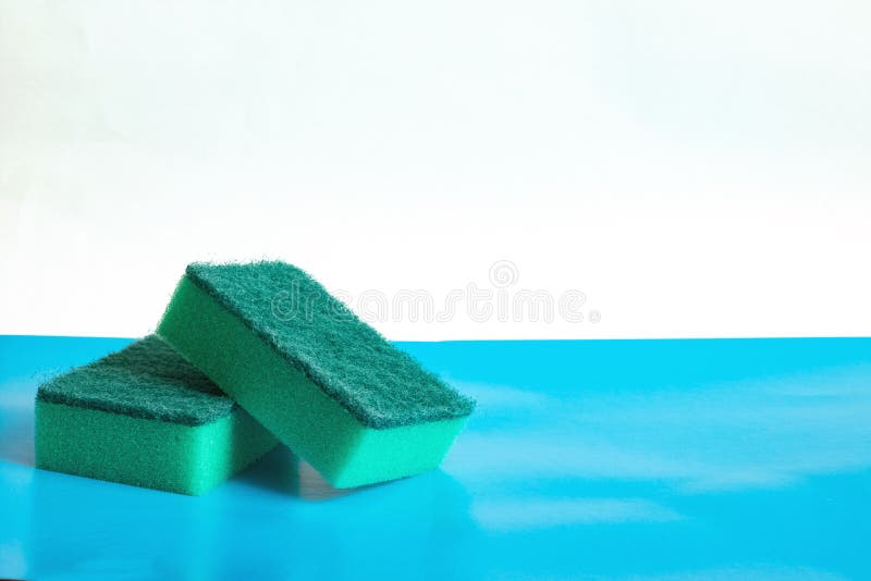 Two Green Sponges for Washing Dishes on Blue Table Stock Image - Image ...
