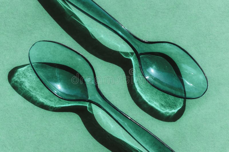 Two Green Transparent Plastic Spoons with Contrasting Shadows Stock ...