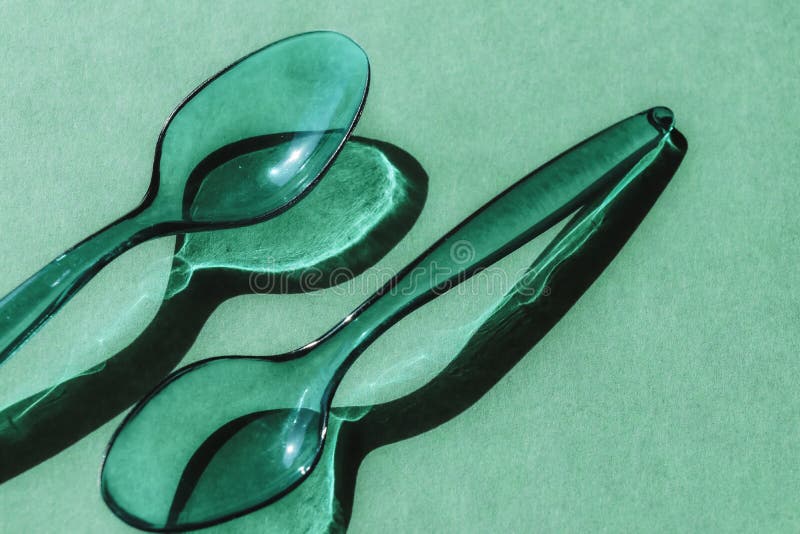 Two Green Transparent Plastic Spoons with Contrasting Shadows Stock ...