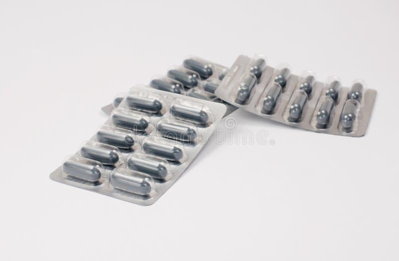 Two grey pills on white stock image. Image of help, blister - 17929107