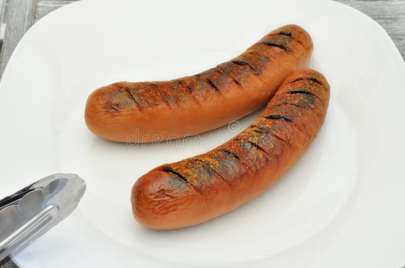 Two sausages on a plate stock image. Image of plate, meat - 13643145