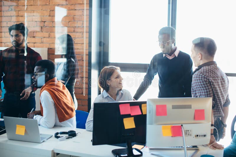 Two Groups of Workers Sitting Back To Back and Working Stock Image ...