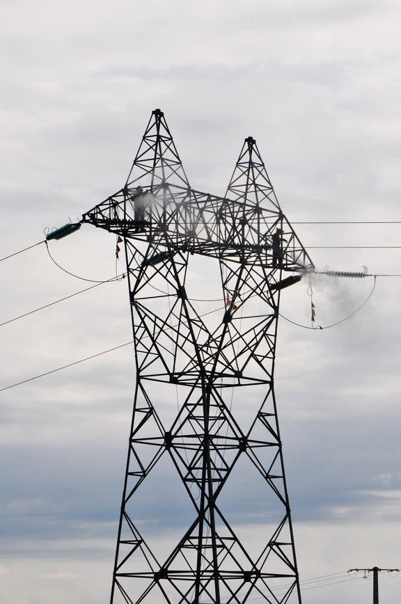 Two Guys Cleaning Big Electrical Pylon Stock Image - Image of difficult ...
