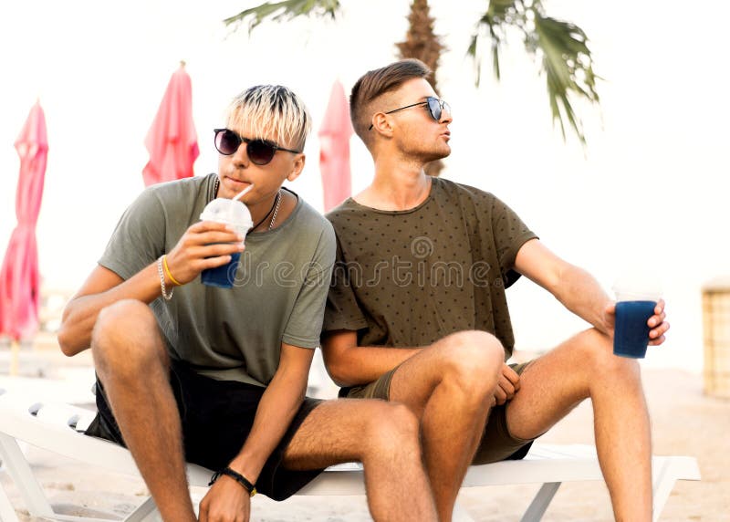 Two Guys Drink Cocktails on a Tropical Beach Stock Image - Image of ...