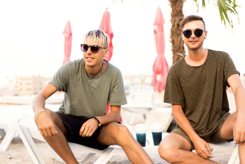 Two Guys Drink Cocktails on a Tropical Beach Stock Photo - Image of ...