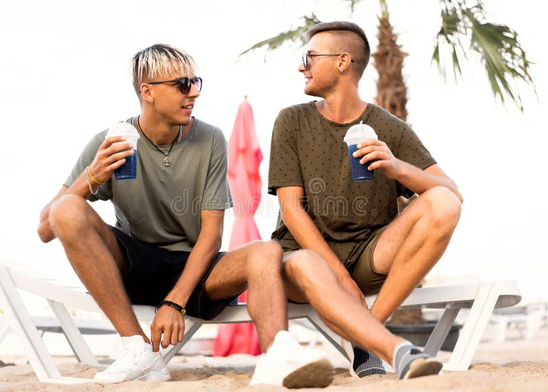 Two Guys Drink Cocktails on a Tropical Beach Stock Photo - Image of ...