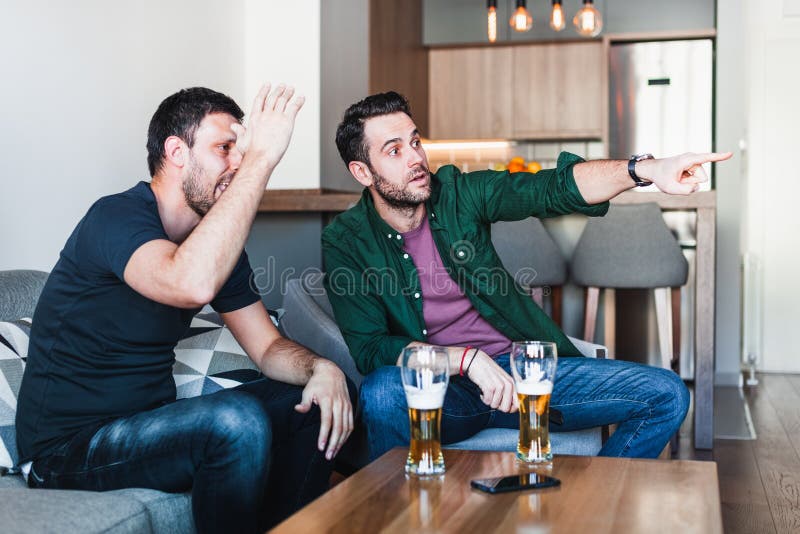 Two Guys Drinking Beer Watching Football Stock Photo - Image of goal ...