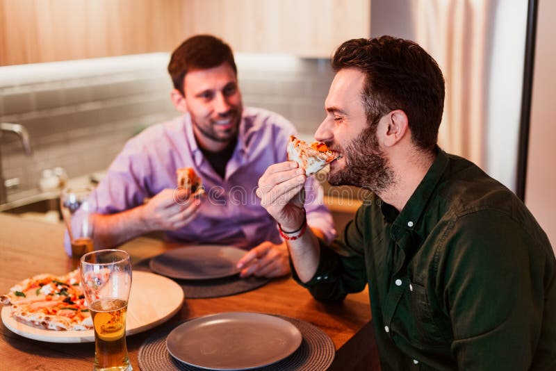 Two Guys Eating Pizza Beer at Home Stock Photo - Image of casual ...