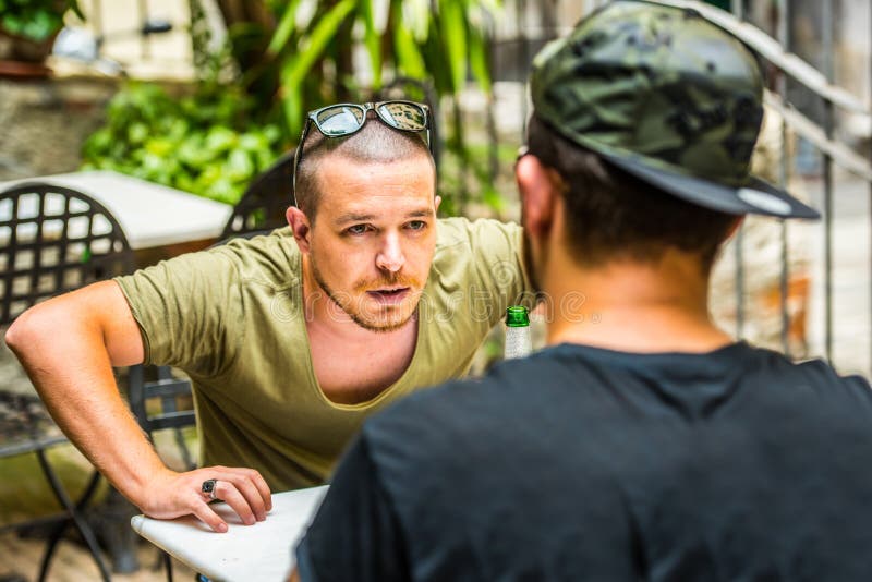 Two Guys Having an Argument Stock Photo - Image of adults, beers: 98171104