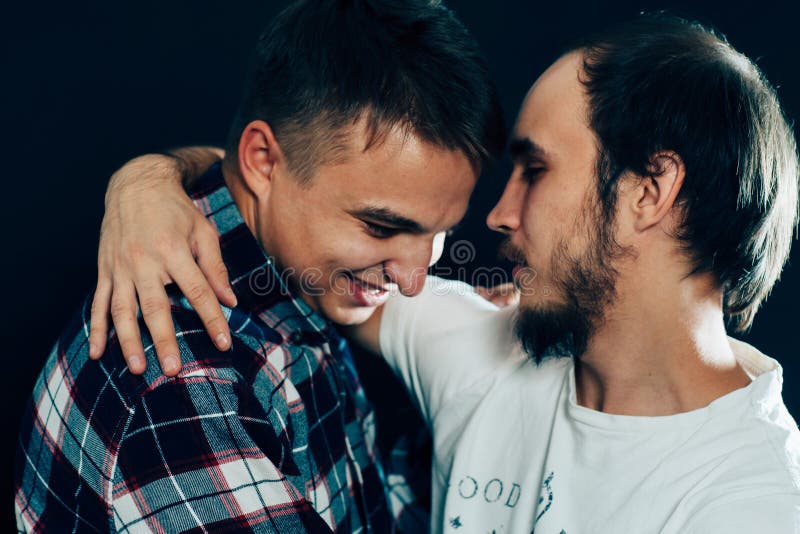 Two Guys Hugging on a Dark Background Stock Image - Image of college ...