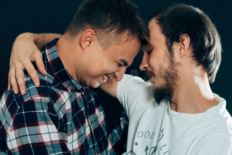 Two Guys Hugging on a Dark Background Stock Photo - Image of lifestyle ...