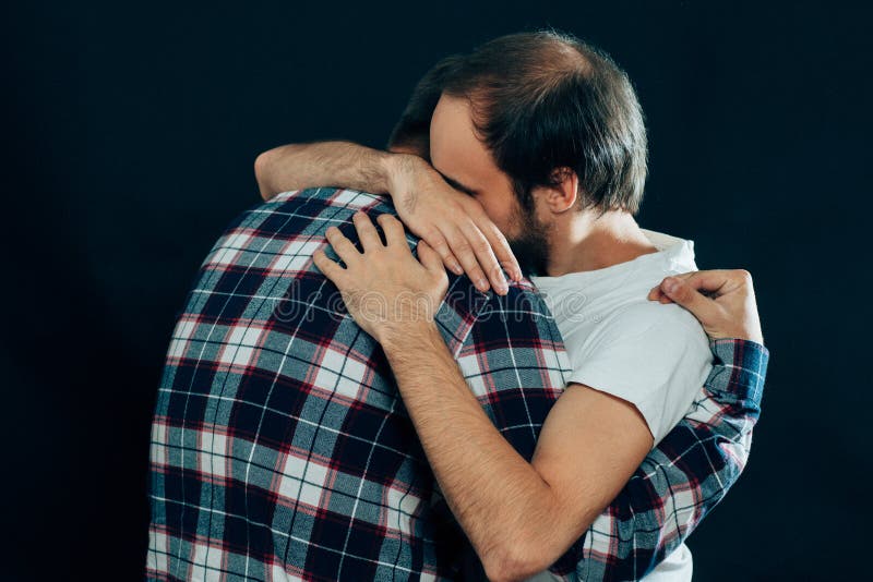Two Guys Hugging on a Dark Background Stock Image - Image of college ...