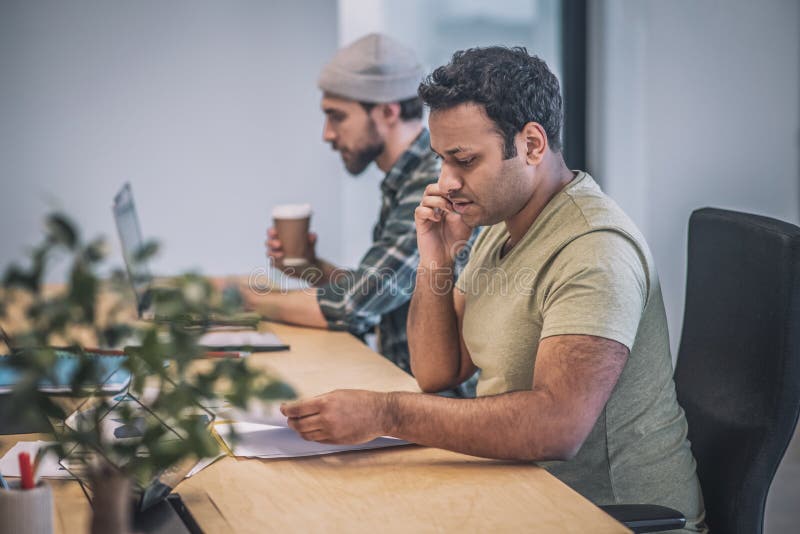 Two Guys with Laptop and Smartphone Working in Office Stock Image ...