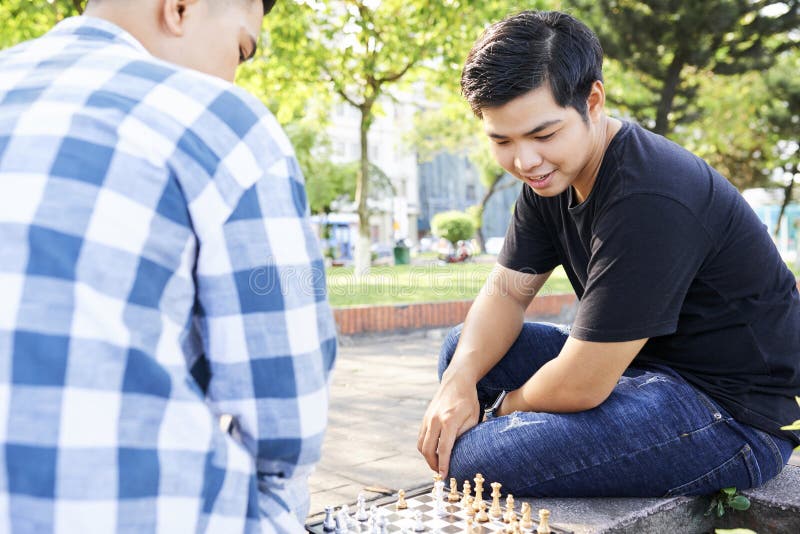 Two guys playing chess stock image. Image of outdoors - 213314089