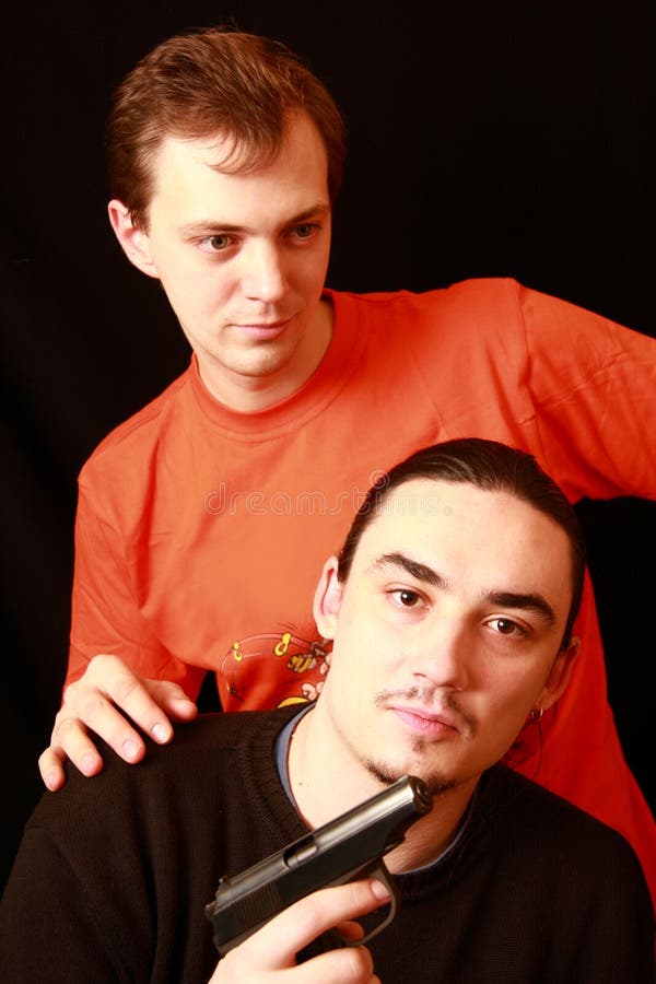 Two guys playing with gun stock photo. Image of bang, smith - 7296444