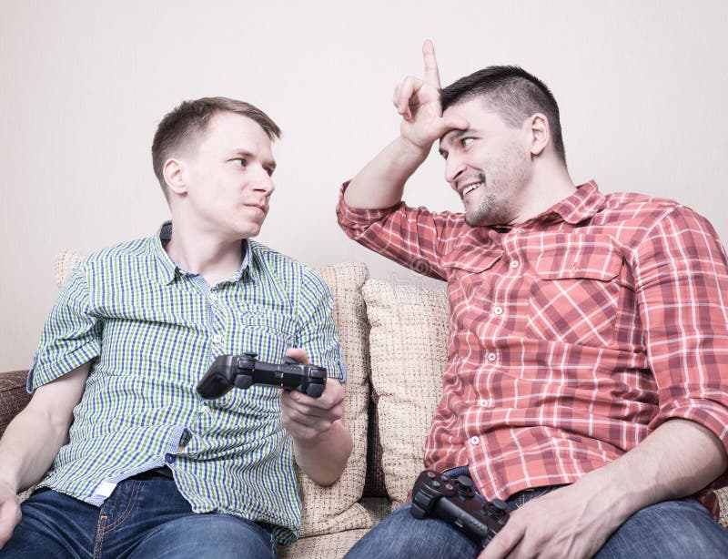 Two Guys Playing Video Games Stock Photo - Image of playing, confidence ...