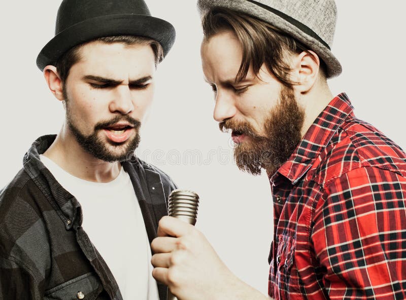 Lifestyle and People Concept: Young Bearded Man Singing with Microphone ...
